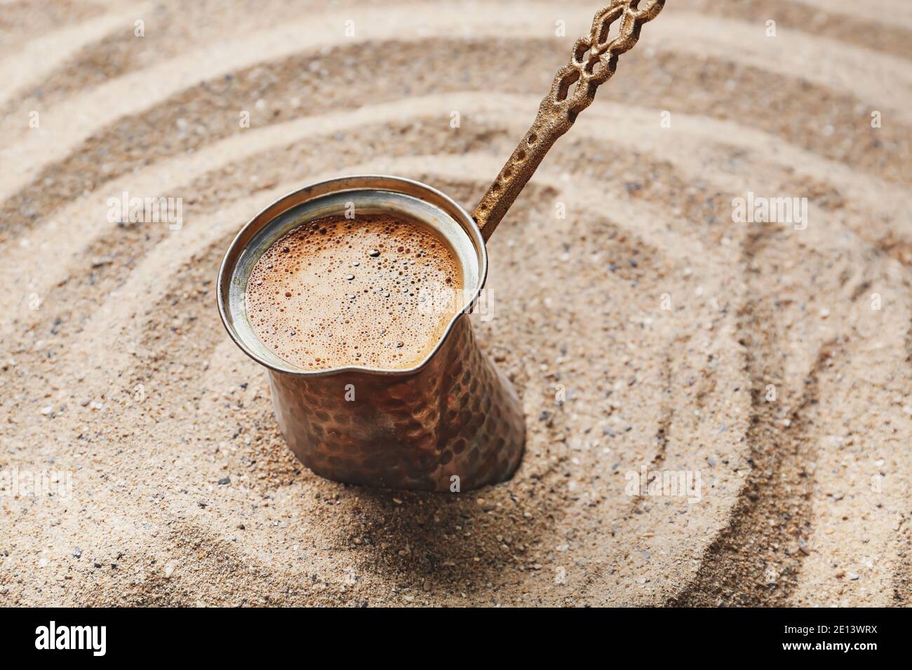 Turkish coffee cooked in sand, closeup Stock Photo - Alamy