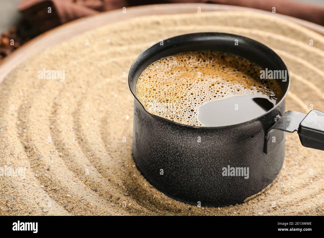Turkish coffee cooked in sand, closeup Stock Photo - Alamy
