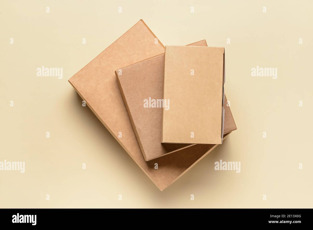 Blank cardboard boxes on color background Stock Photo - Alamy