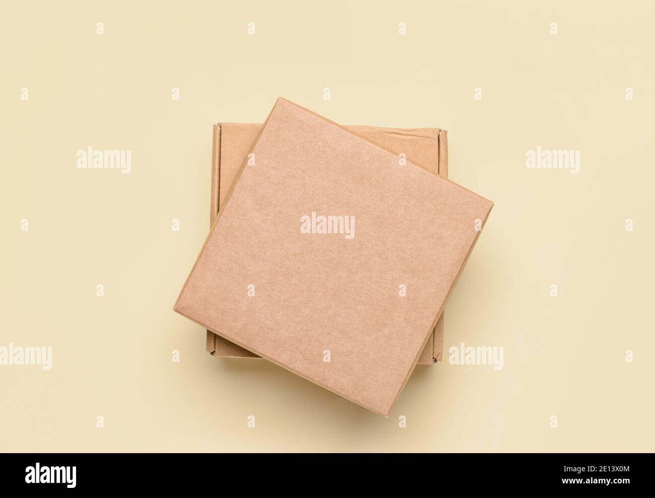Blank cardboard boxes on color background Stock Photo - Alamy