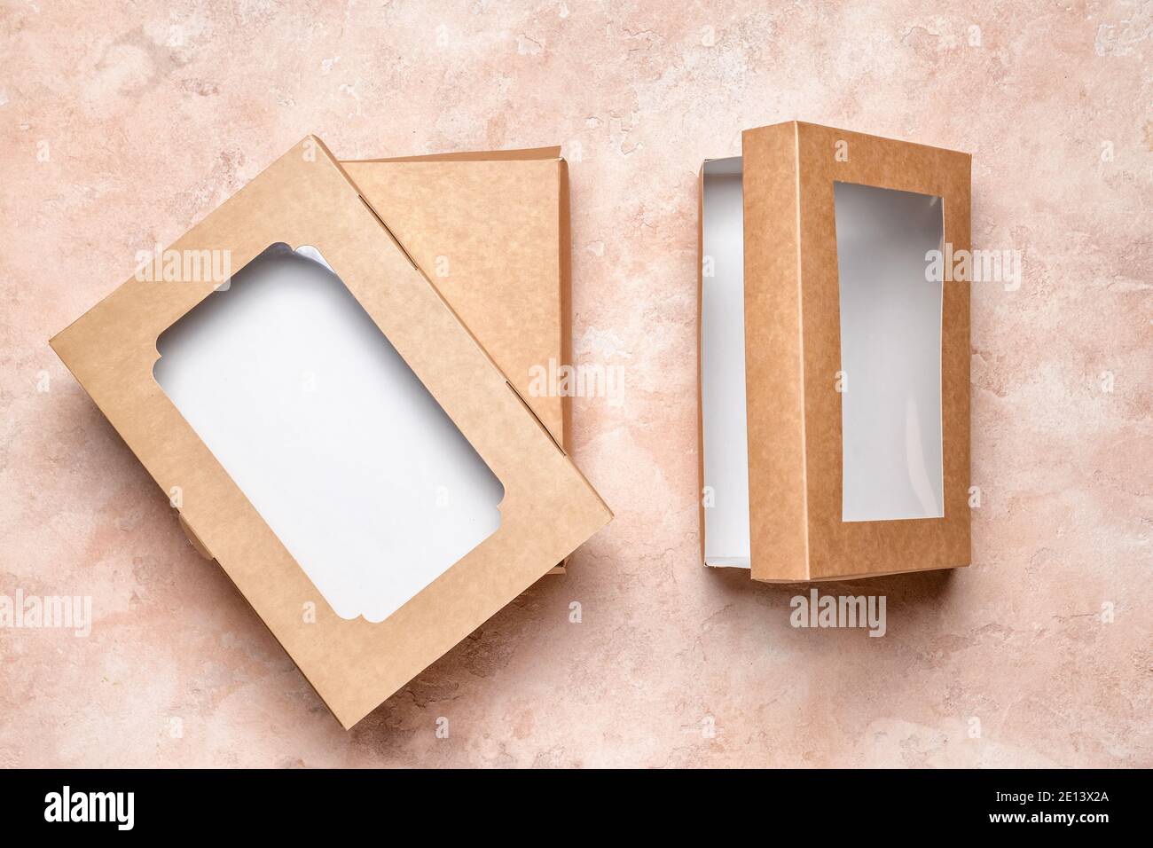 Blank cardboard boxes on color background Stock Photo - Alamy