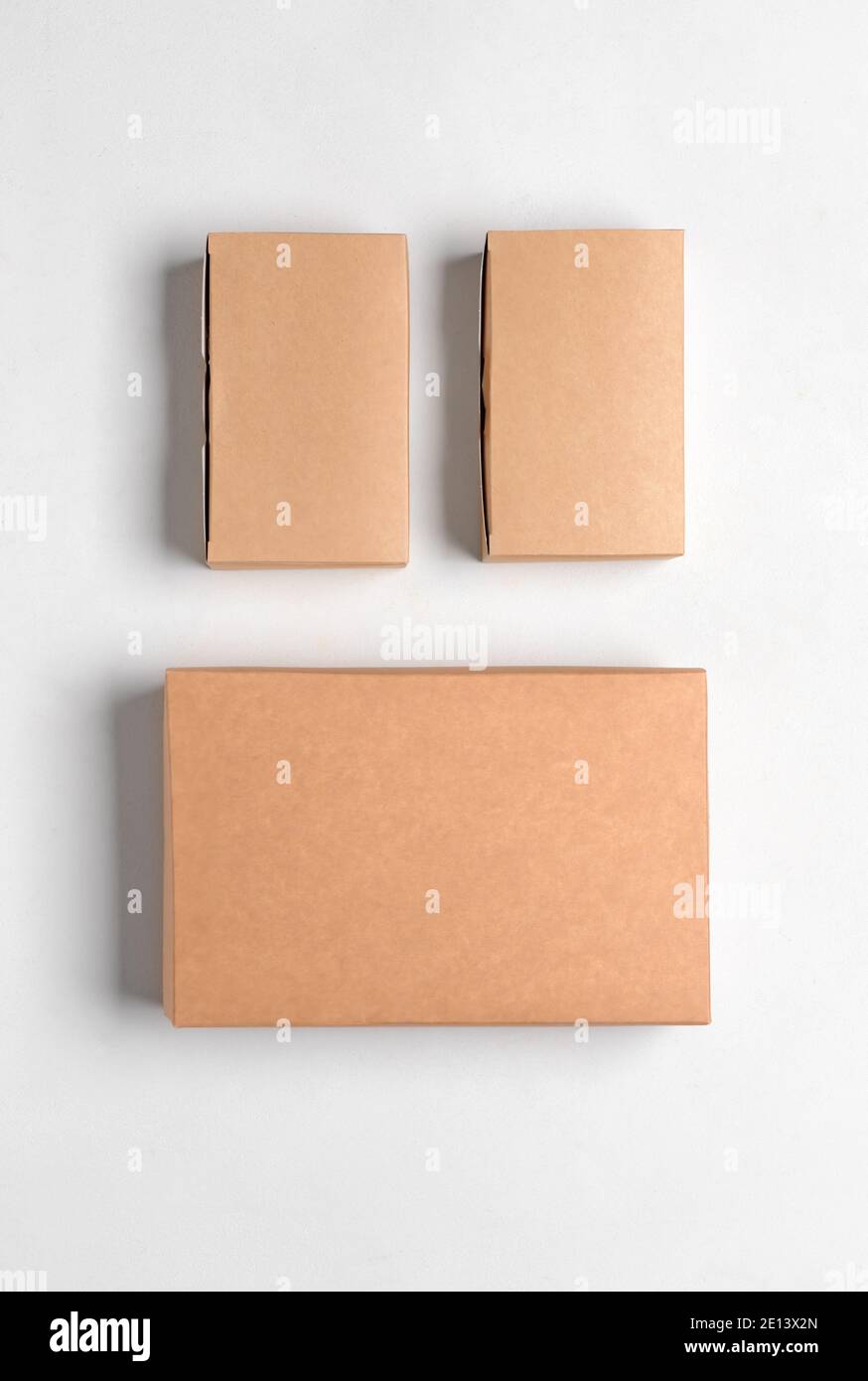 Blank cardboard boxes on white background Stock Photo - Alamy