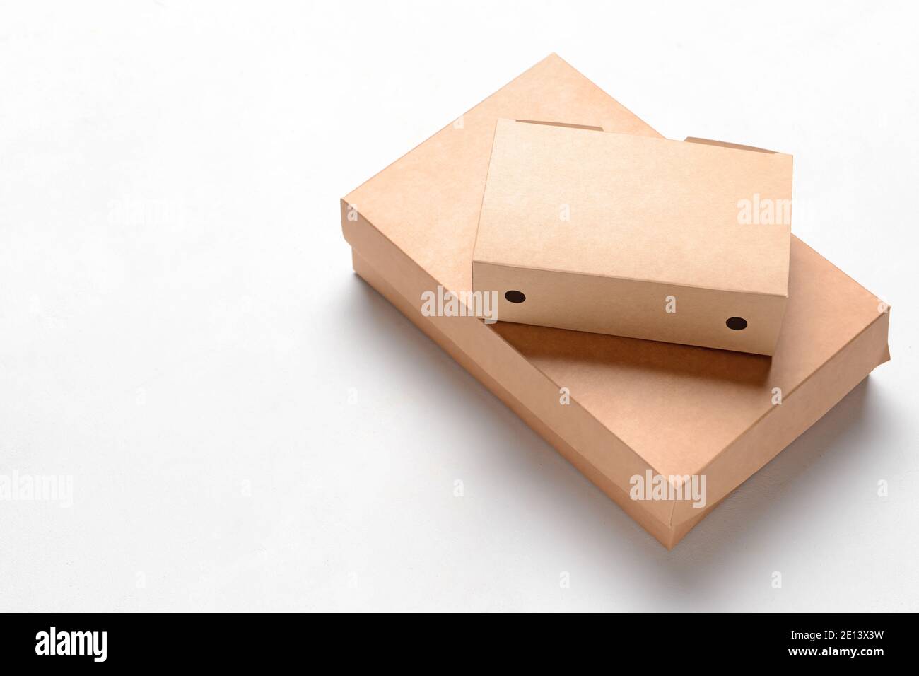 Blank cardboard boxes on white background Stock Photo - Alamy