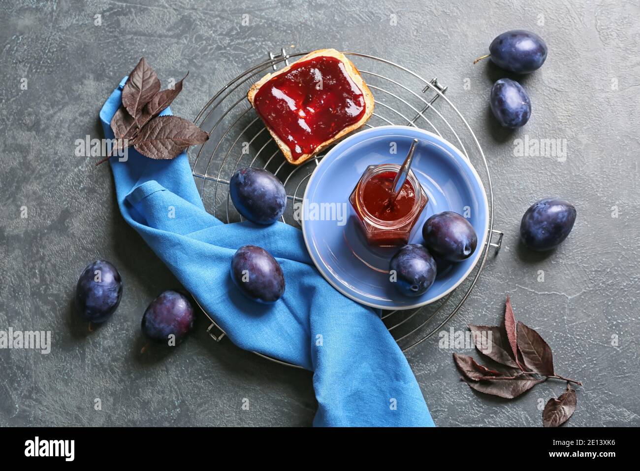 Composition with delicious homemade plum jam on table Stock Photo - Alamy