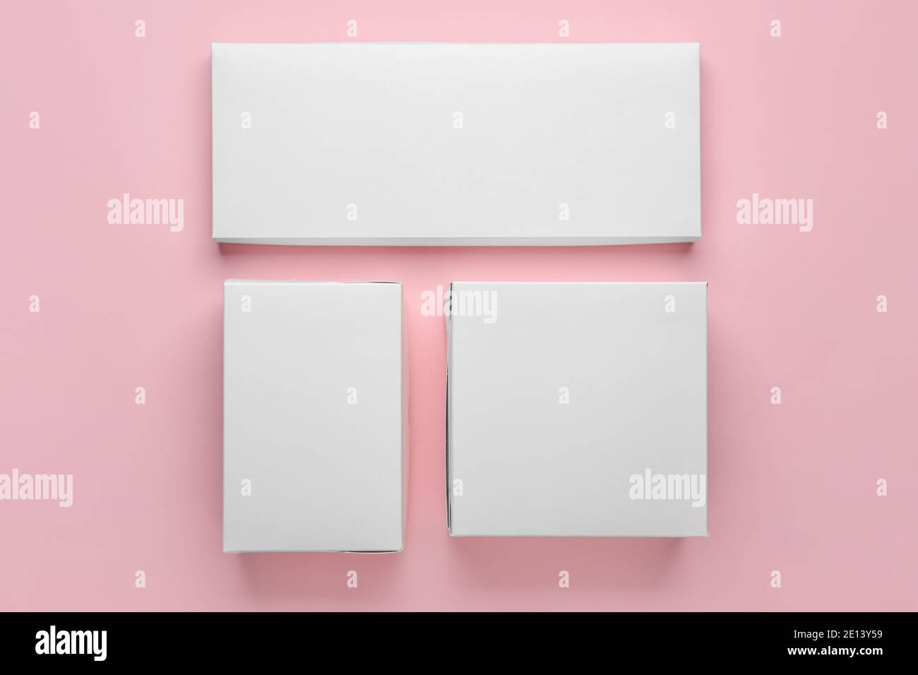 Blank cardboard boxes on color background Stock Photo - Alamy