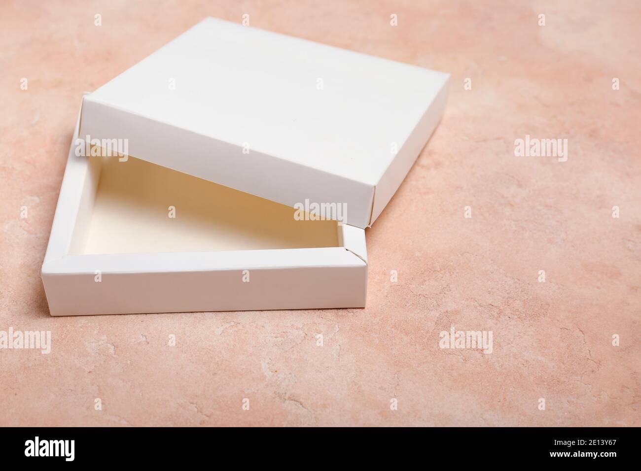Blank cardboard boxes on color background Stock Photo - Alamy