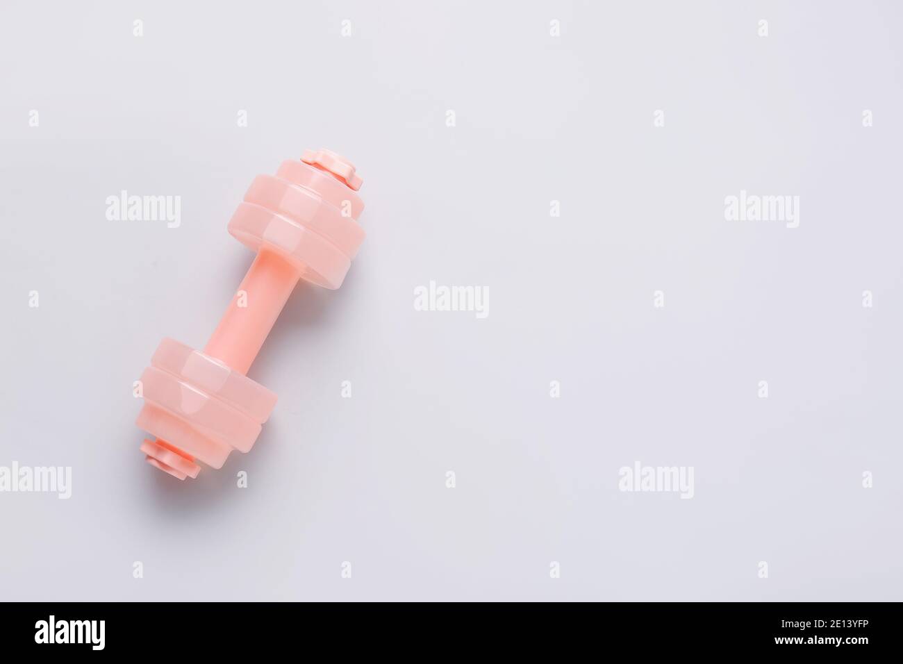 Stylish dumbbell on light hi-res stock photography and images - Alamy