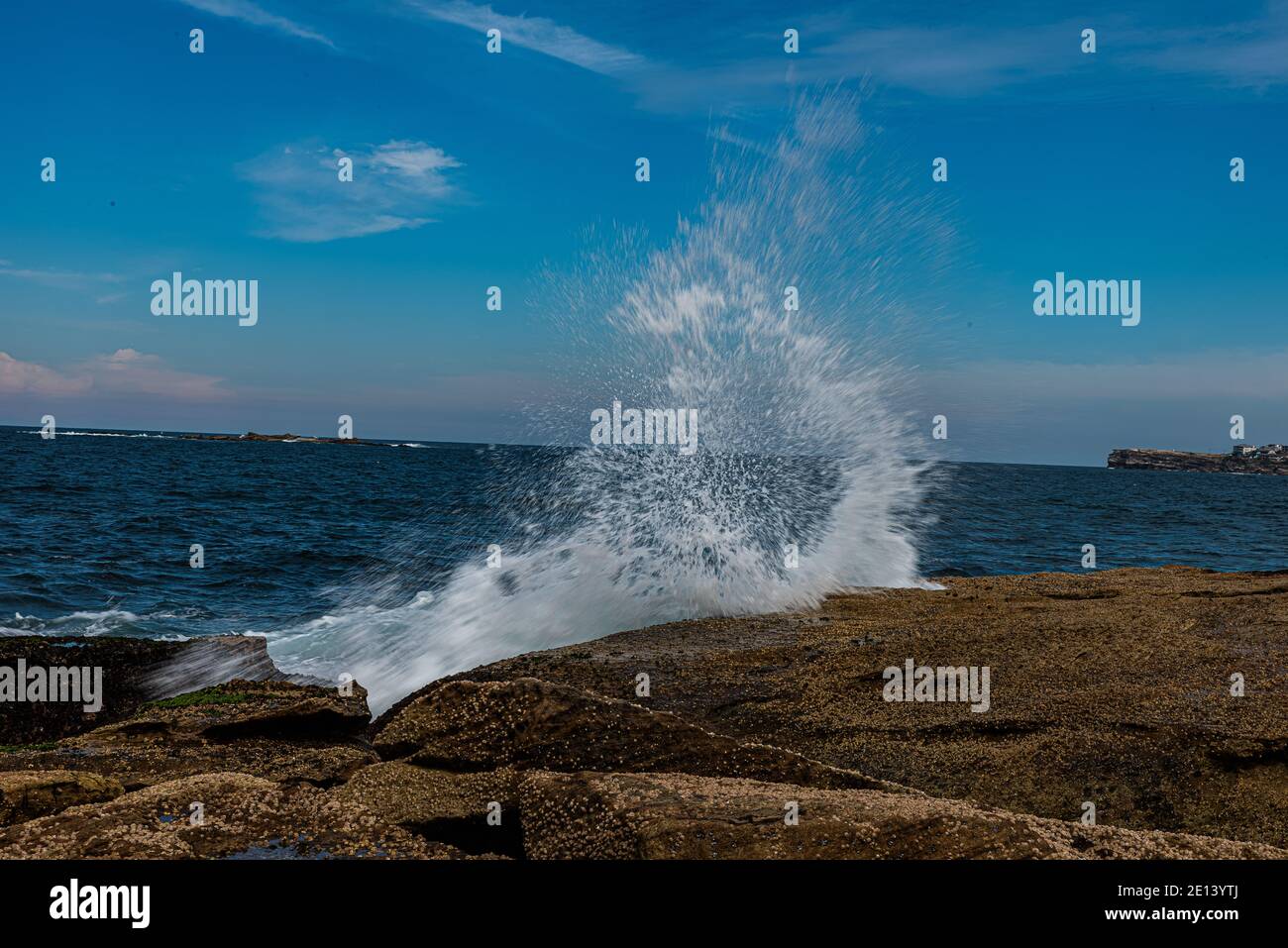 The wave hitting on the rocks Stock Photo - Alamy