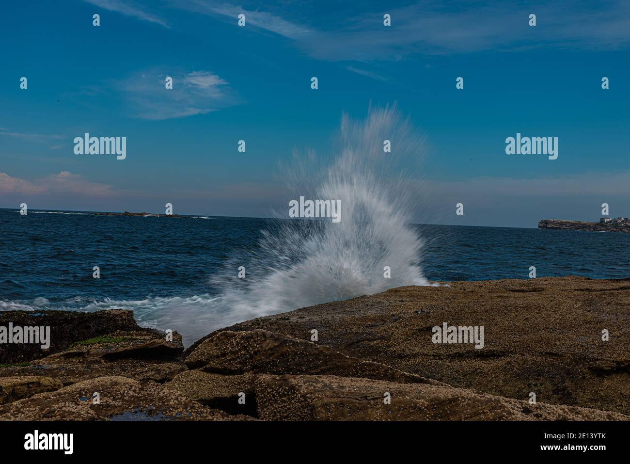 Waves hitting cliff on beach hi-res stock photography and images - Alamy