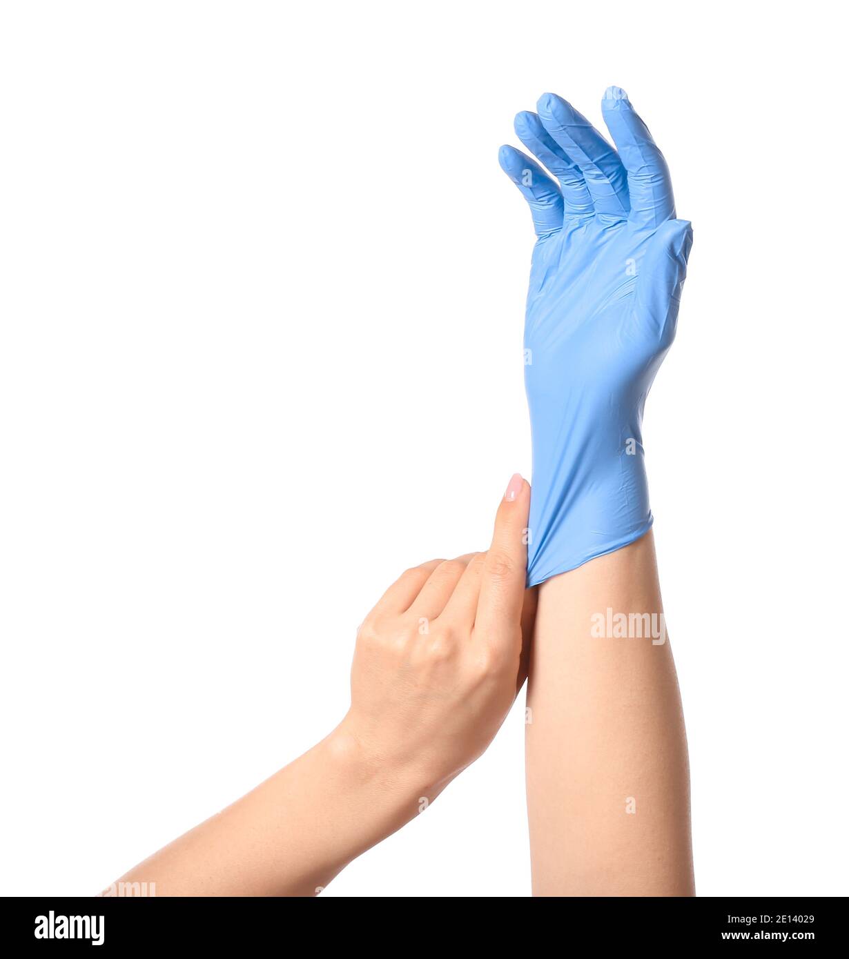 Woman taking off protective gloves on white background Stock Photo - Alamy