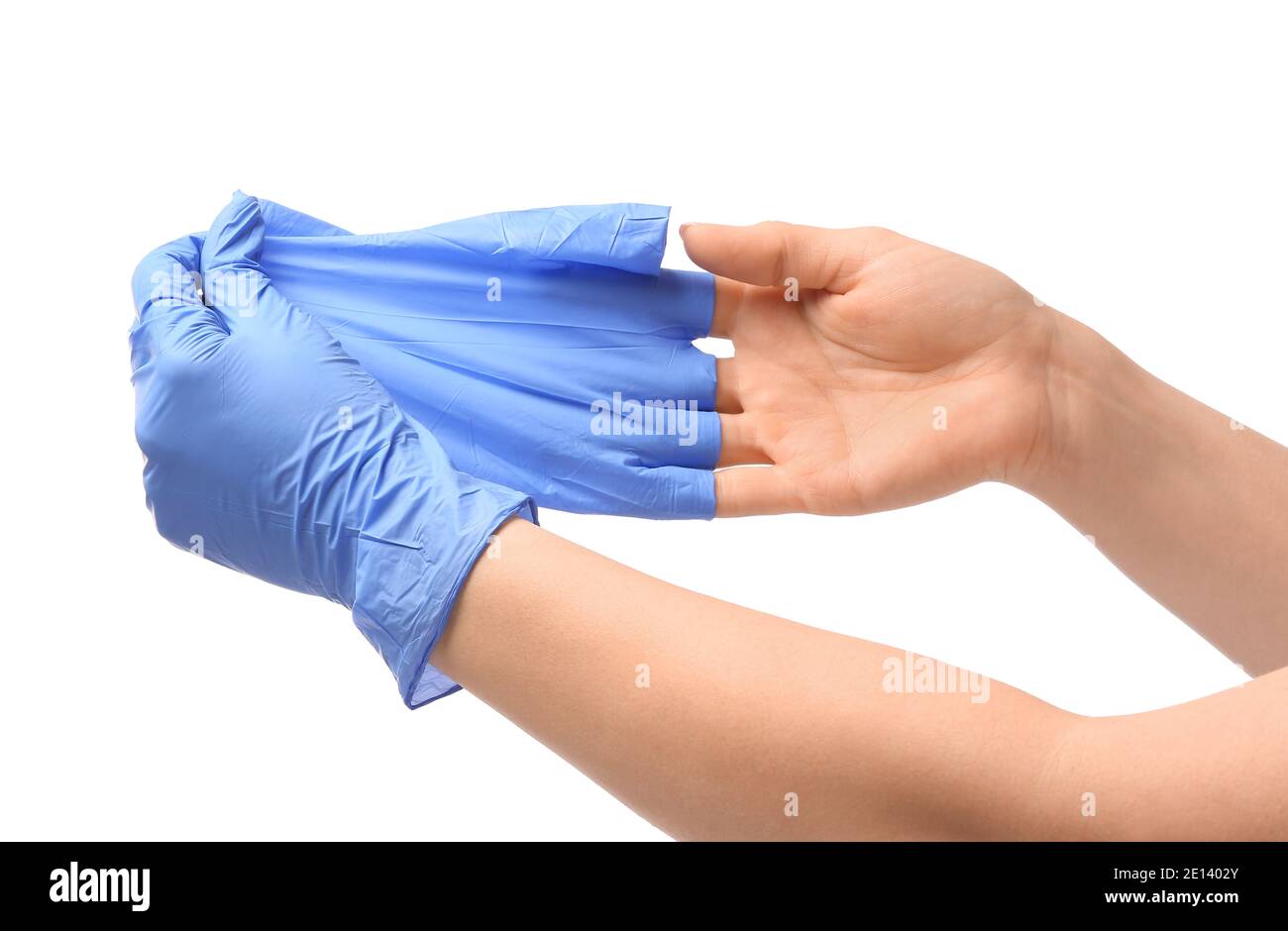Woman taking off protective gloves on white background Stock Photo - Alamy