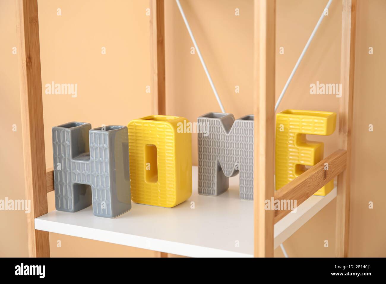 Word HOME on shelf in room Stock Photo - Alamy