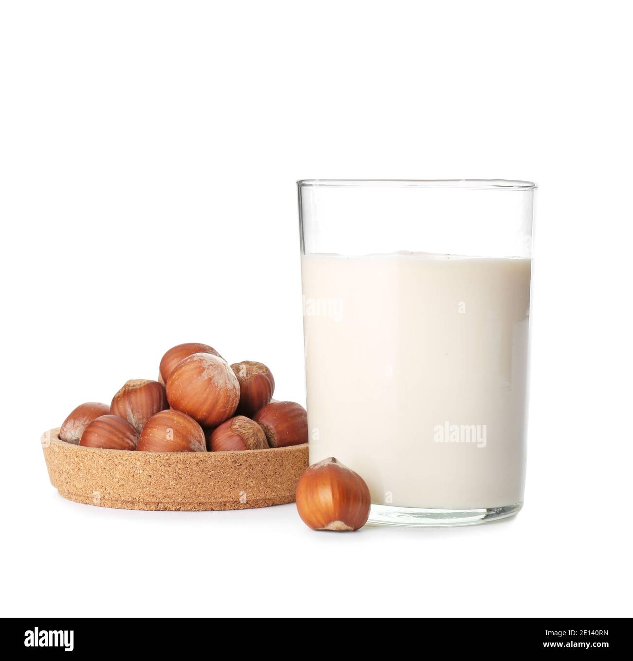 Glass of hazelnut milk isolated on white background Stock Photo - Alamy