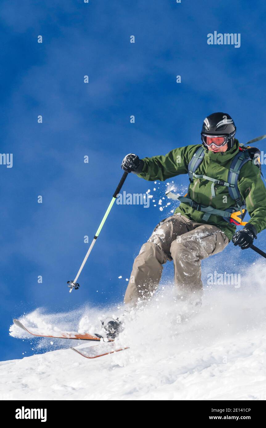 Telemark skier skiing on steep off-piste slope Stock Photo - Alamy