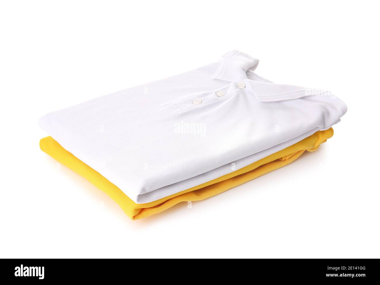 Stack of folded polo shirts on white background Stock Photo - Alamy
