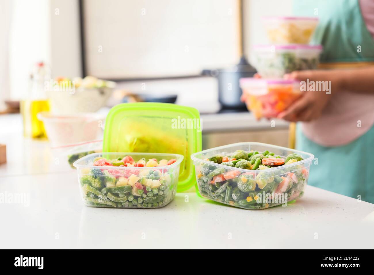 Woman holding containers different hi-res stock photography and images ...