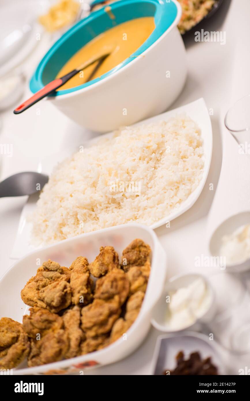 Beautiful ready lunch on dining table in modern home Stock Photo - Alamy