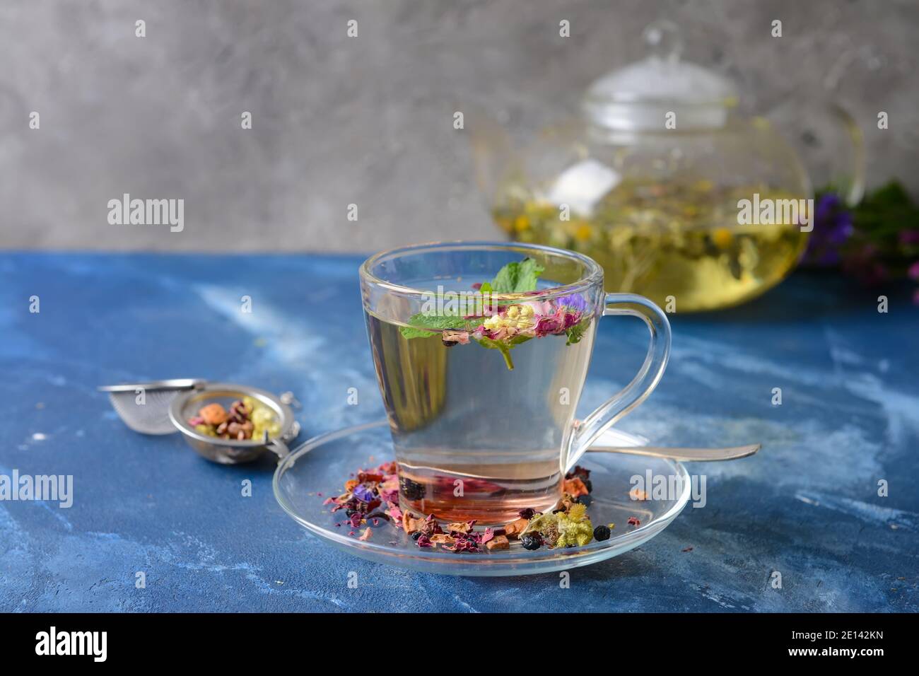 Cup with floral tea on table Stock Photo - Alamy