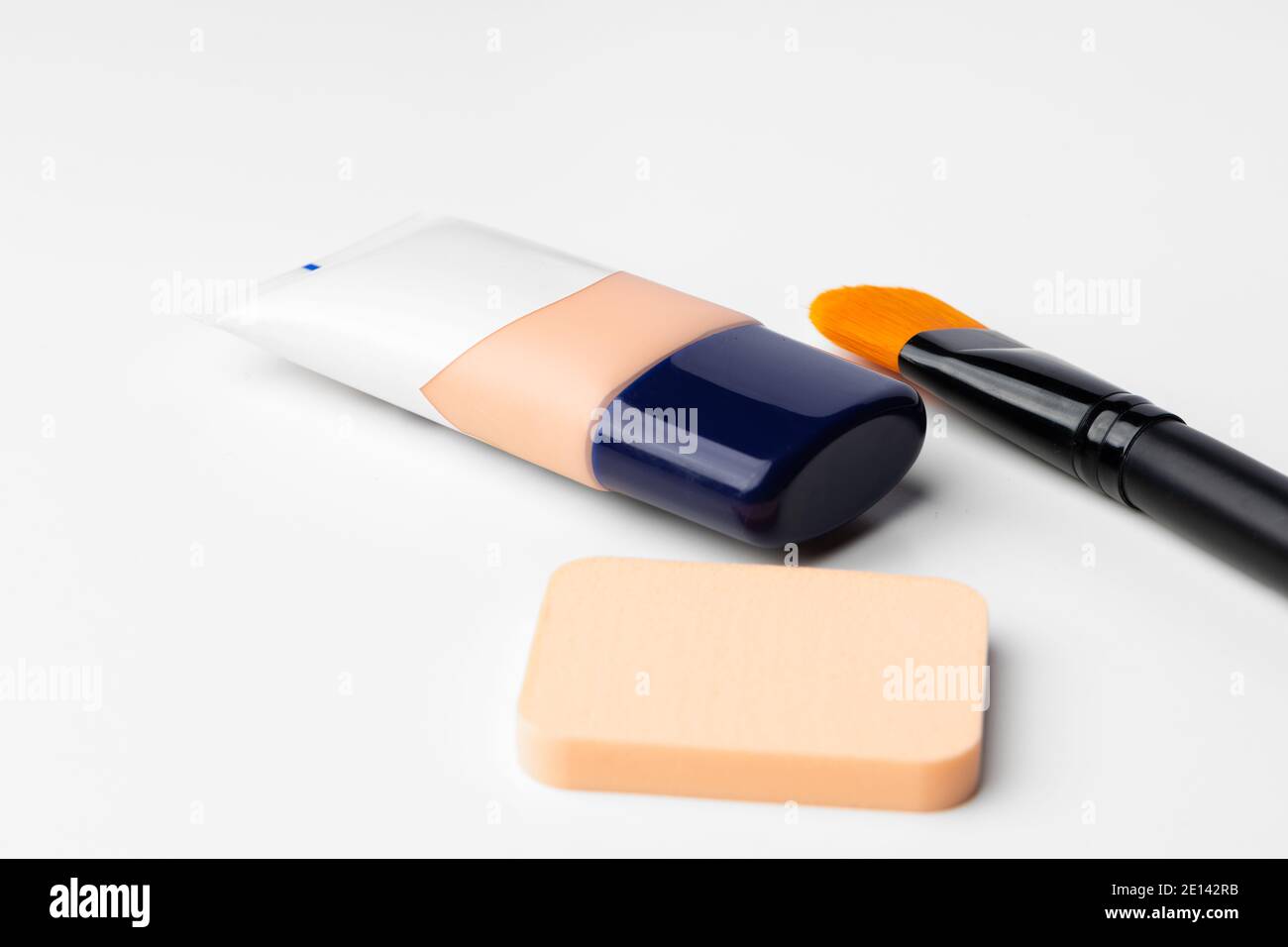 Make up liquid foundation with brush on white background Stock Photo ...