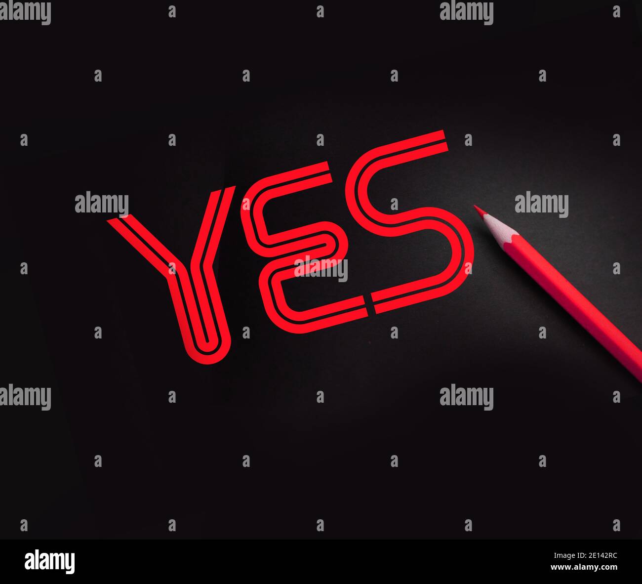 Yes word with red pencil on black background. Positive solution in ...