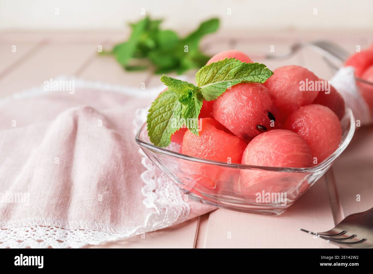 Tasty watermelon balls in bowl on table Stock Photo - Alamy