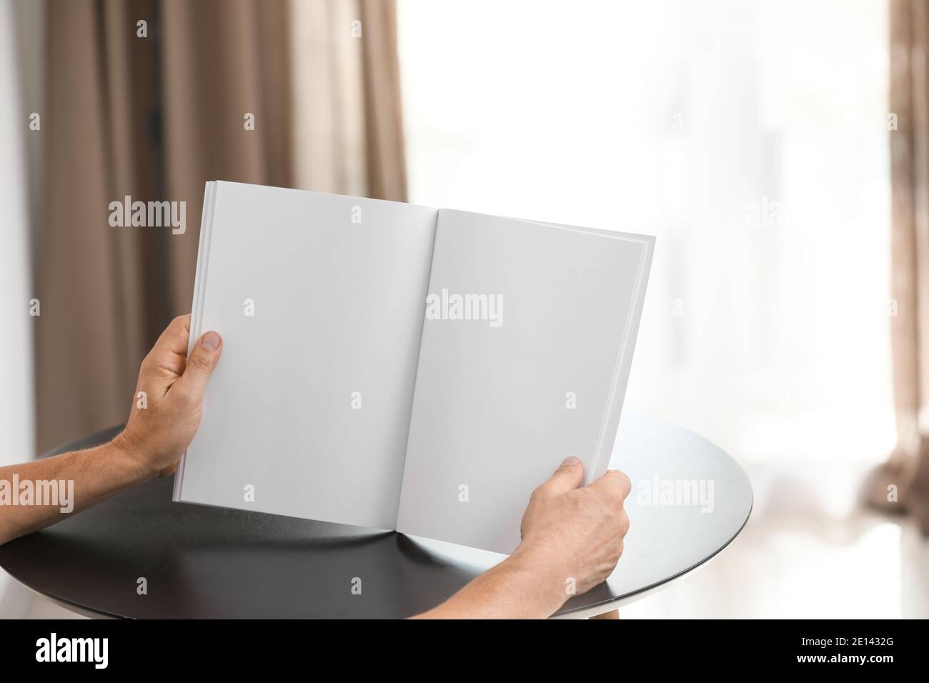 Old man reading magazine sitting hi-res stock photography and images ...