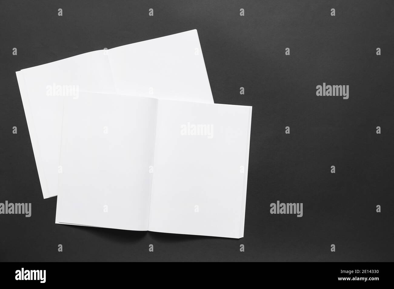 Blank magazines on dark background Stock Photo - Alamy