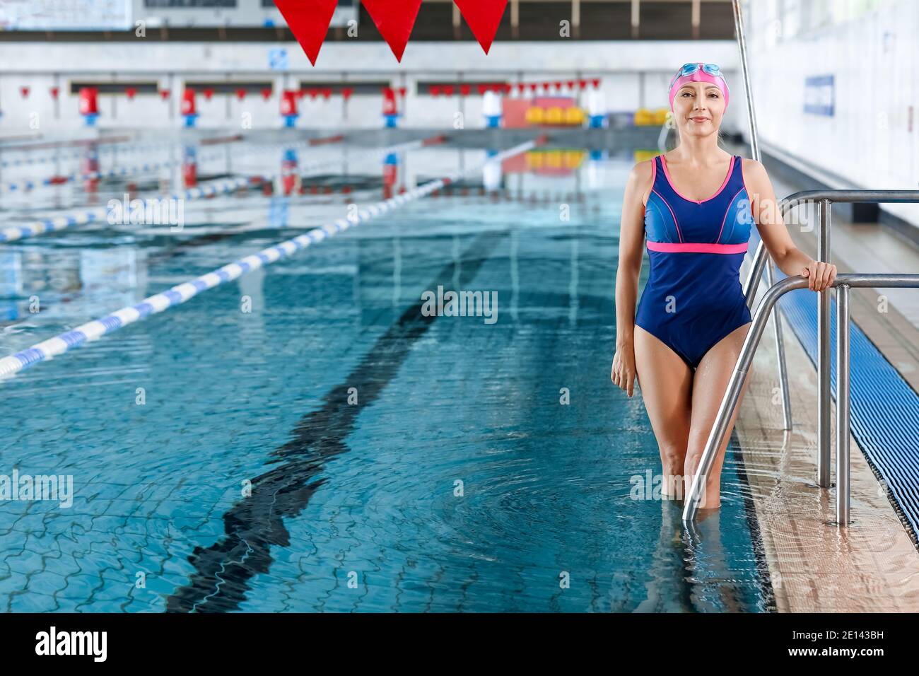 Sporty female swimmer in pool Stock Photo - Alamy