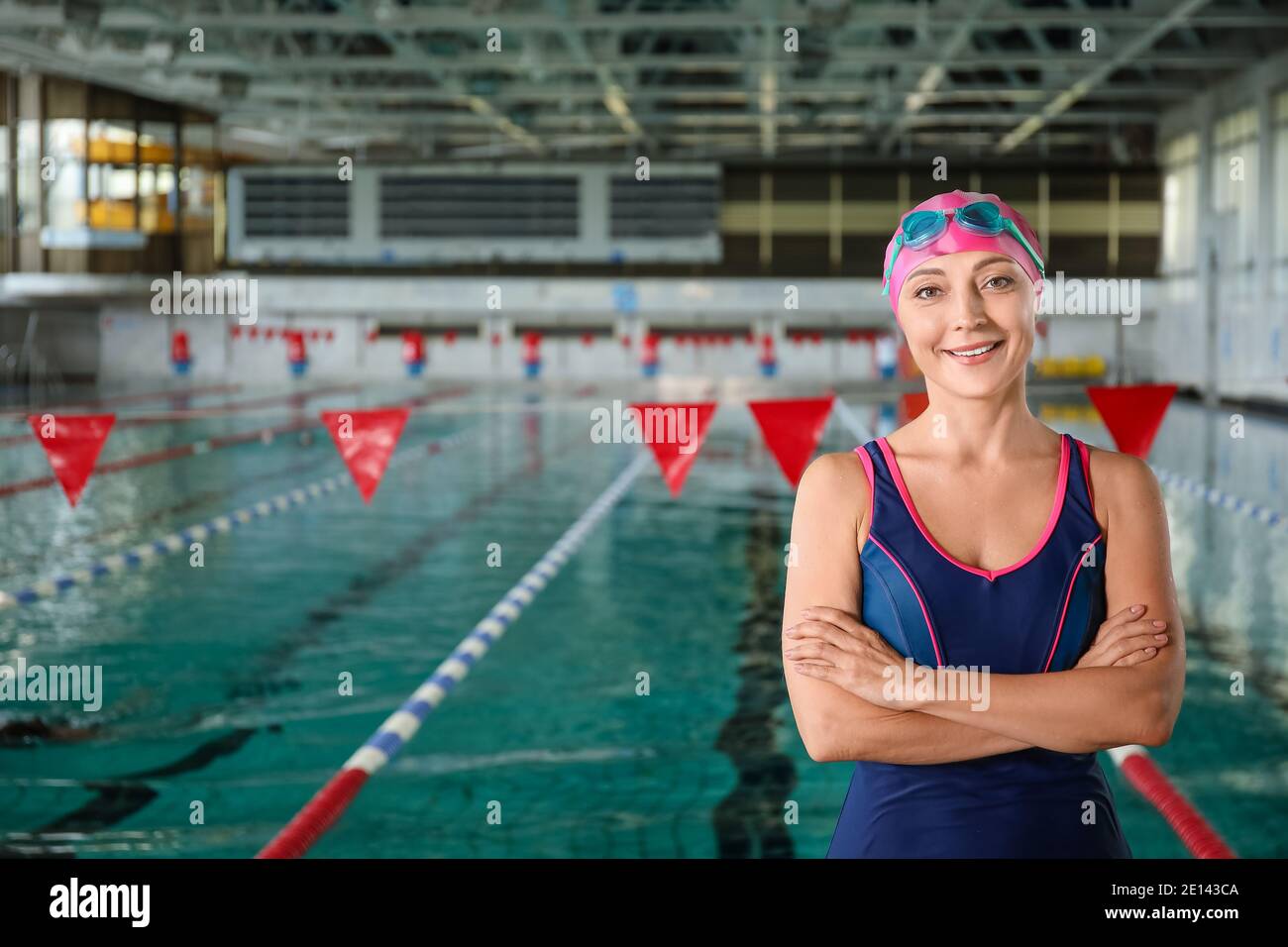 Sporty female swimmer in pool Stock Photo - Alamy