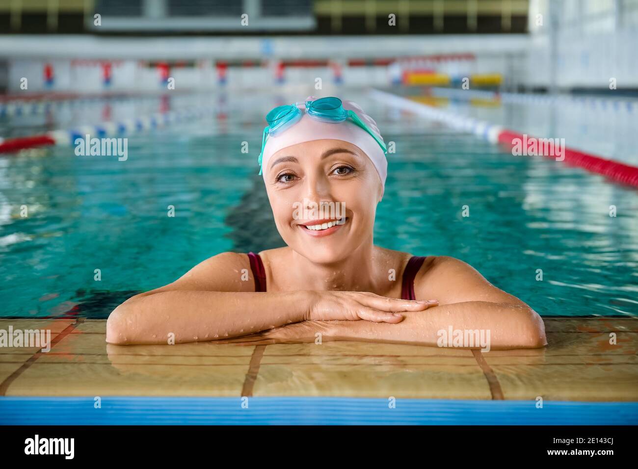 Sporty female swimmer in pool Stock Photo - Alamy