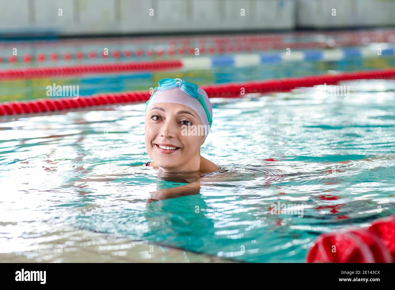 Sporty female swimmer in pool Stock Photo - Alamy
