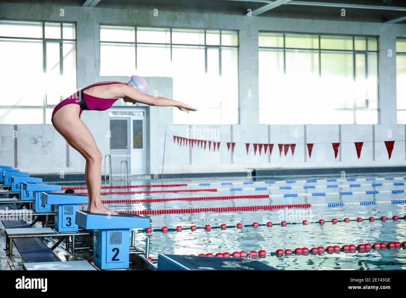 Sporty female swimmer in pool Stock Photo - Alamy