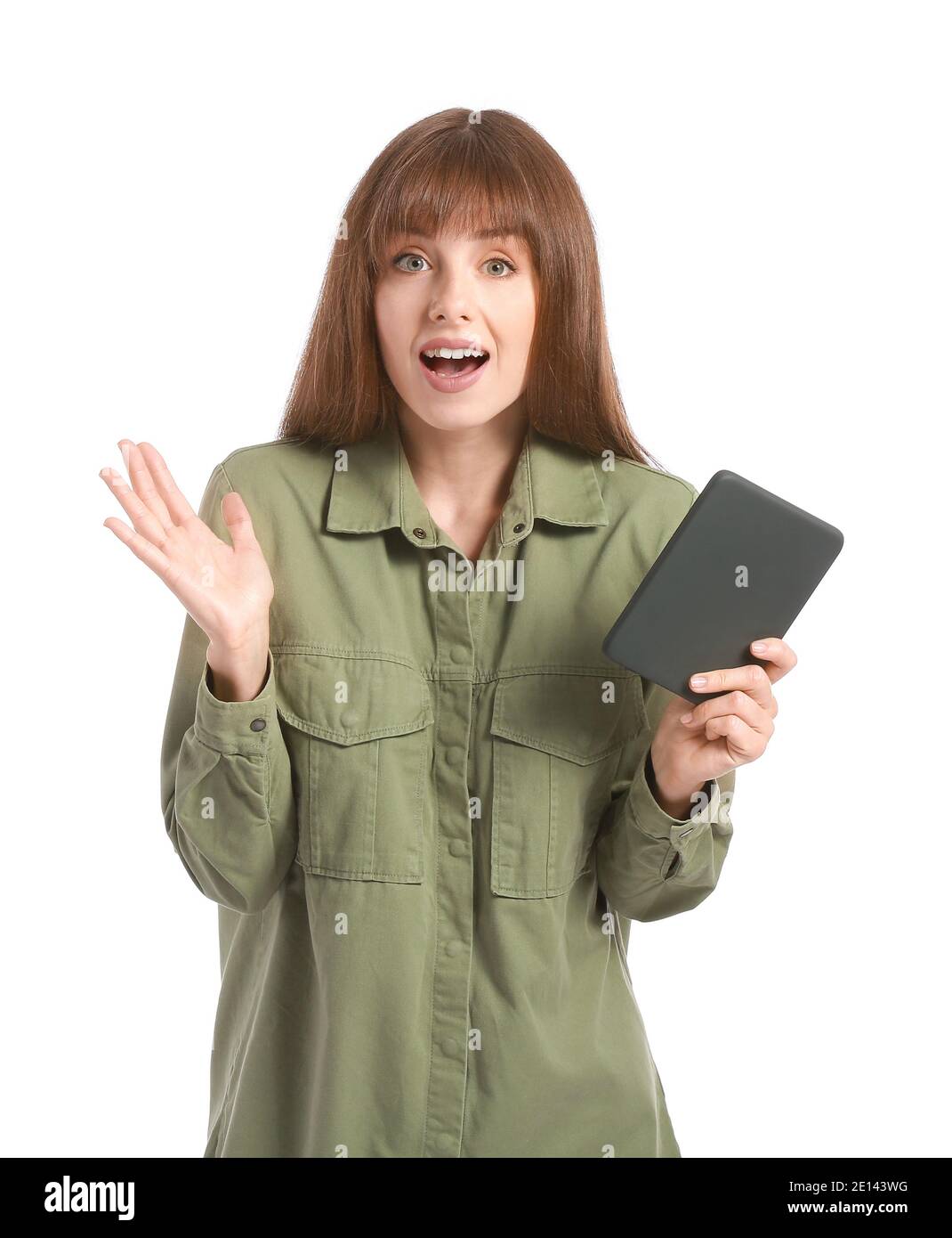 Excited young woman with e-reader on white background Stock Photo - Alamy
