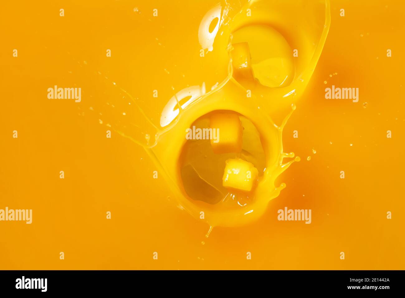 Falling mango cubes juice hi-res stock photography and images - Alamy