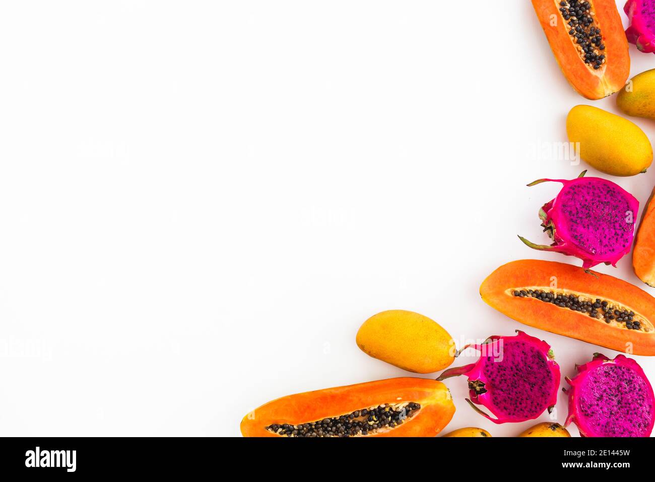 Tropical fruit frame of papaya, mango and dragon fruit on white ...