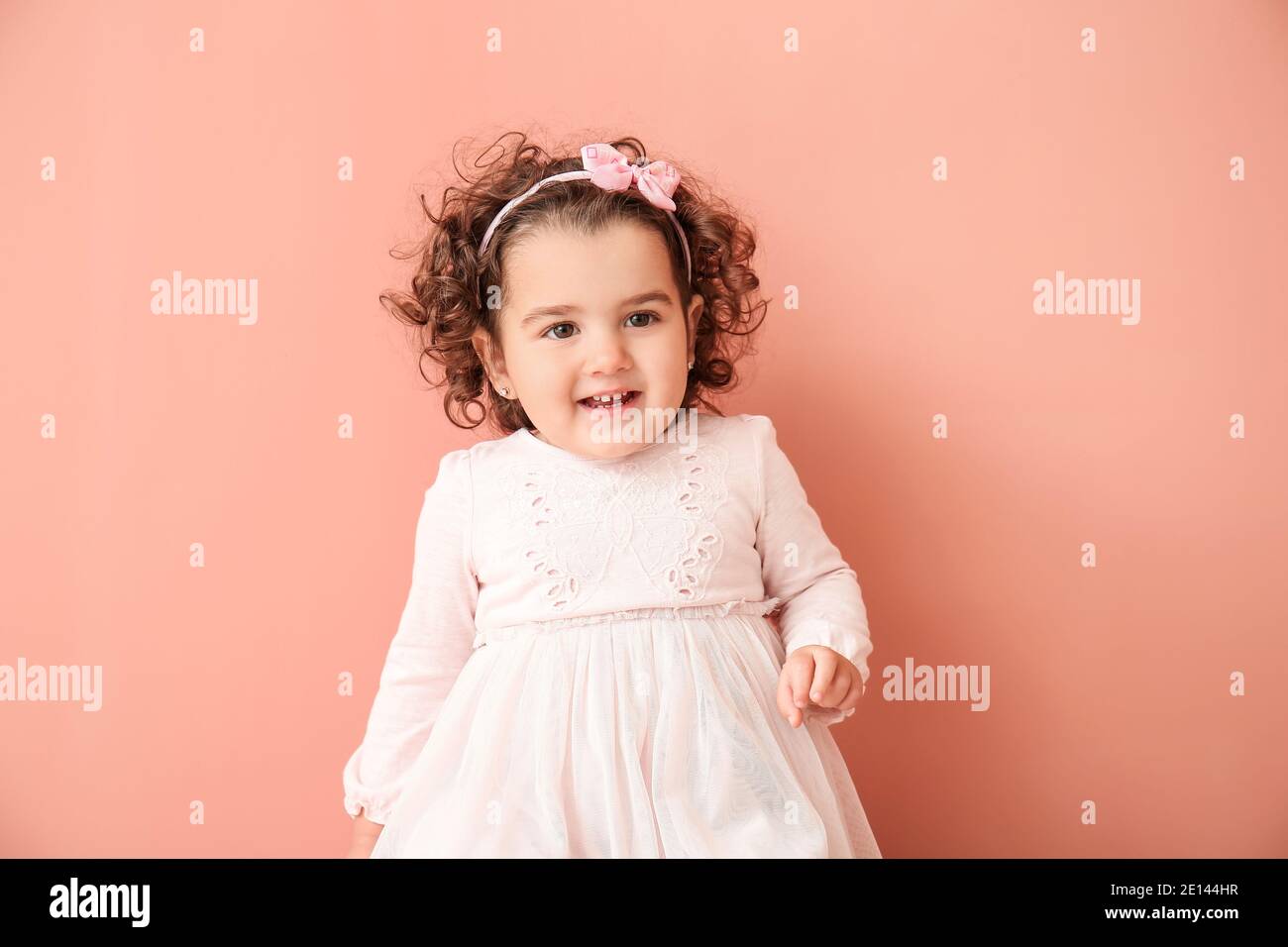 Cute baby girl on color background Stock Photo - Alamy