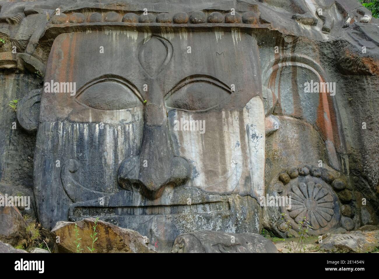 Sculptures carved into the rock at the archaeological site of Unakoti ...