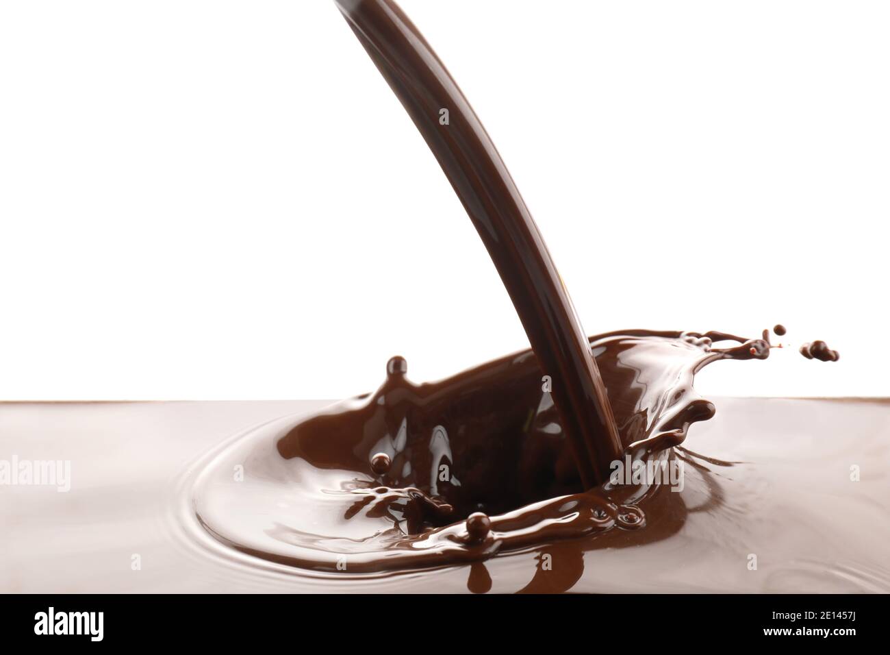 Splash of hot chocolate on white background Stock Photo - Alamy