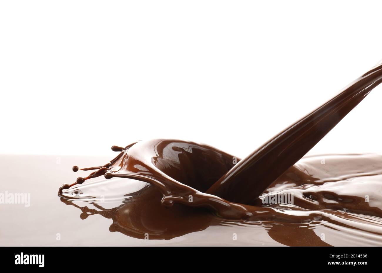 Splash of hot chocolate on white background Stock Photo - Alamy