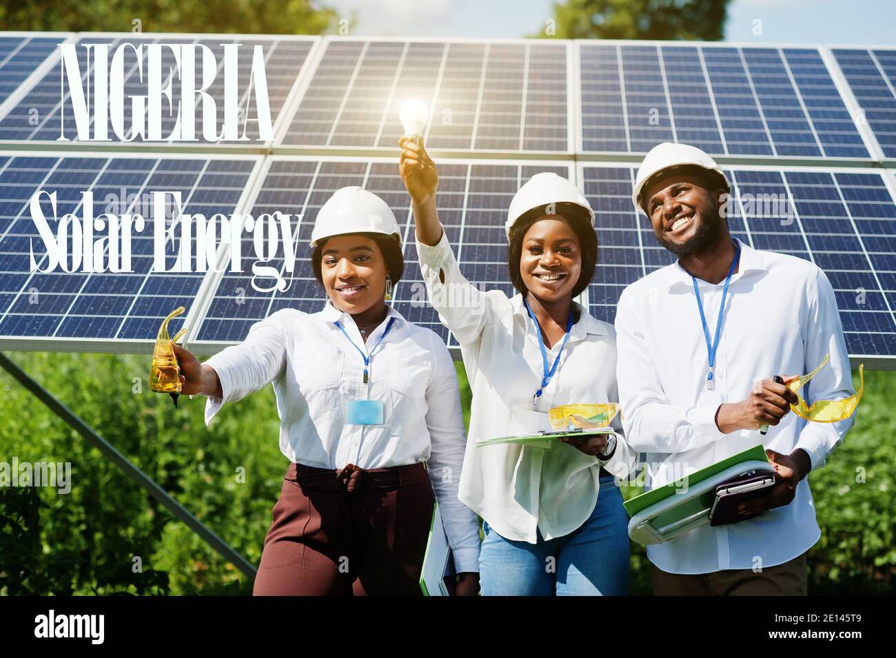 Nigeria solar energy. African engineers at panels station Stock Photo ...
