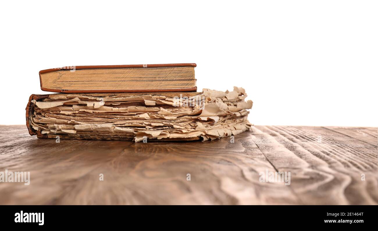 Old books on table against white background Stock Photo - Alamy