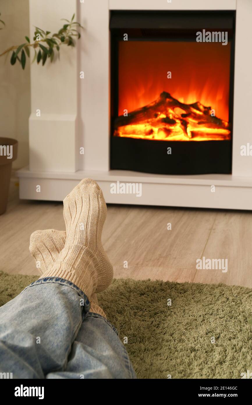Female feet fireplace hi-res stock photography and images - Alamy