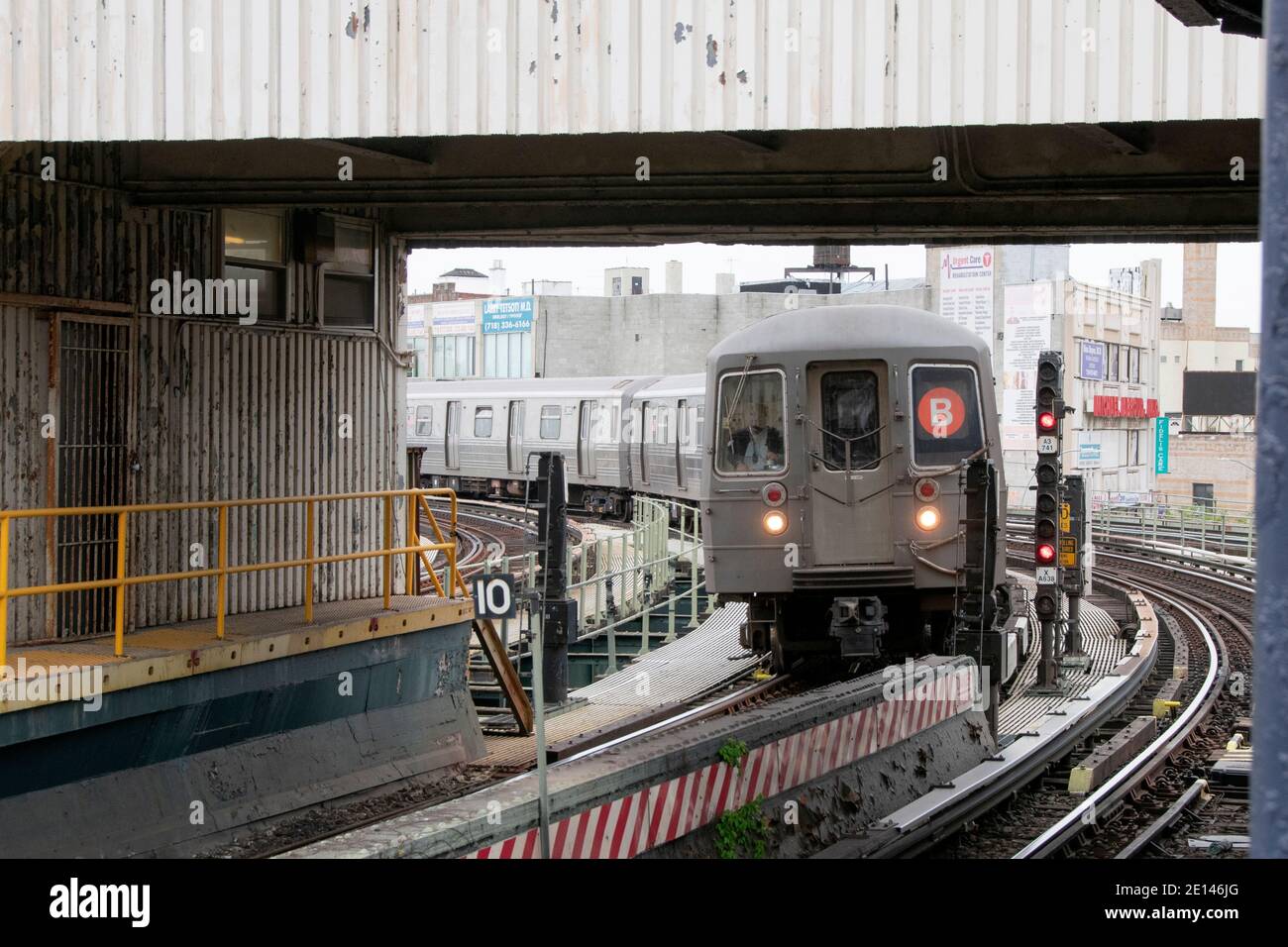 The elevated B Line subway pulls into the Brighton Beach station. In ...