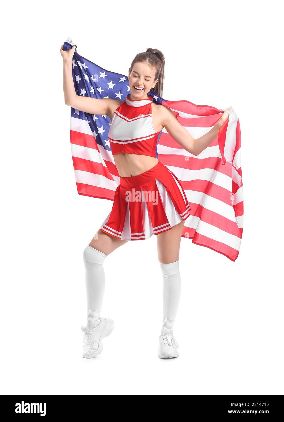 Beautiful young cheerleader with USA flag on white background Stock ...