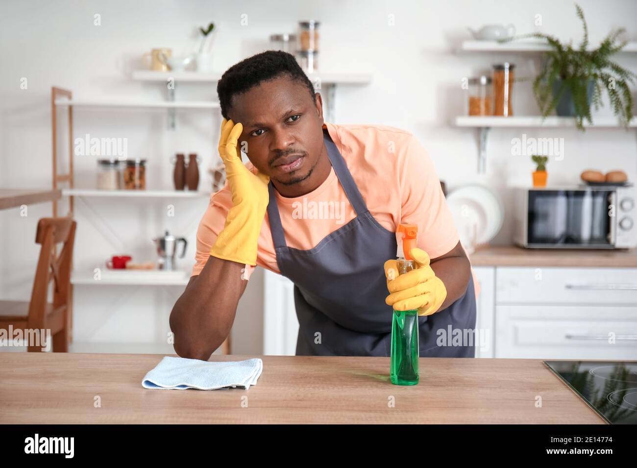 African male cleaning kitchen counter hi-res stock photography and ...