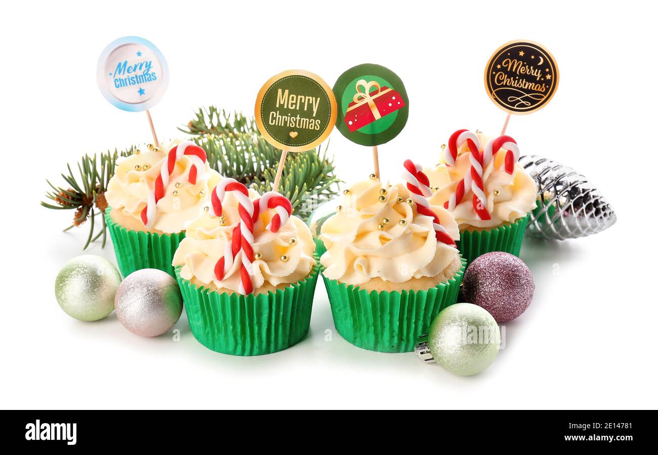 Tasty Christmas cupcakes on white background Stock Photo - Alamy