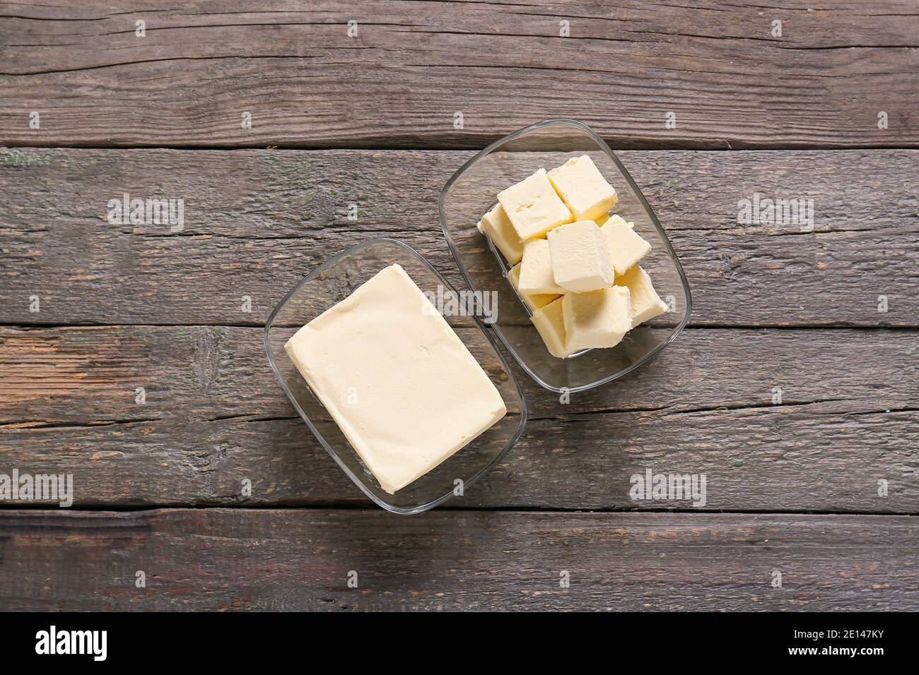 Glass bowls with fresh butter on wooden background Stock Photo - Alamy