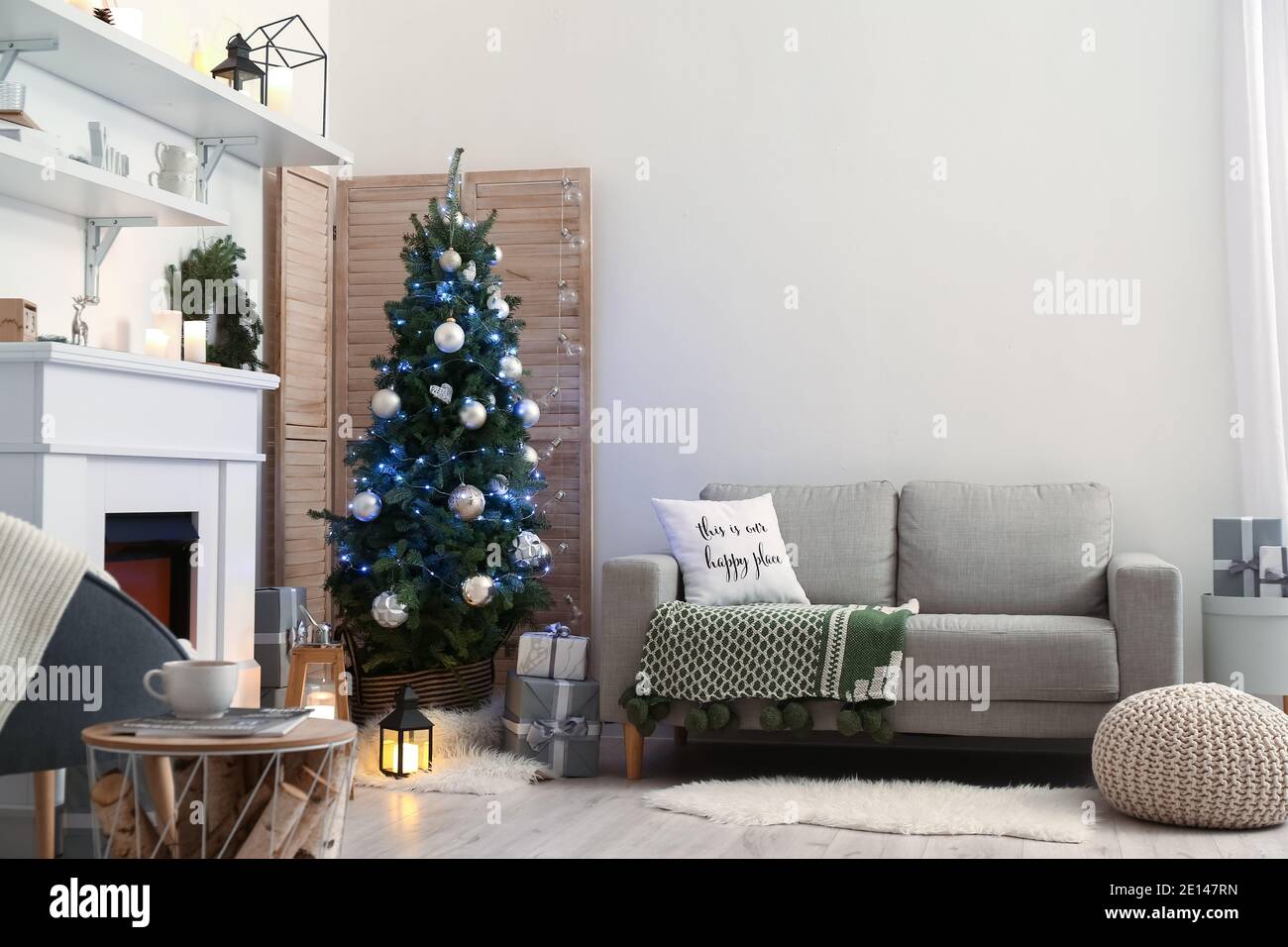 Interior of living room with beautiful Christmas tree and fireplace ...