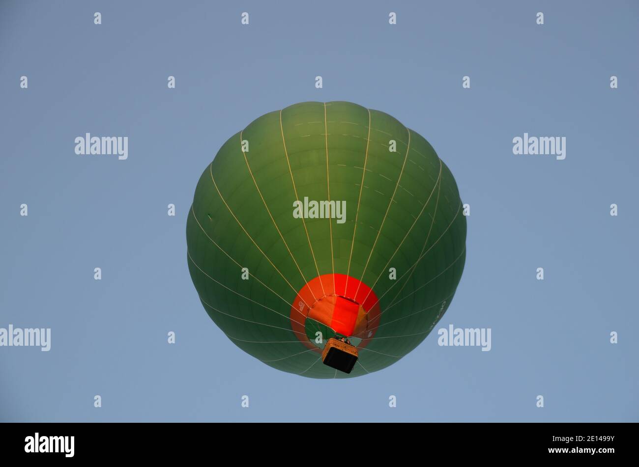 green balloon from below on blue sky in summer Stock Photo - Alamy