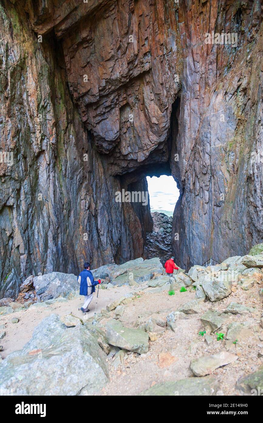 People walks into Torghatten cave in Norway Stock Photo - Alamy